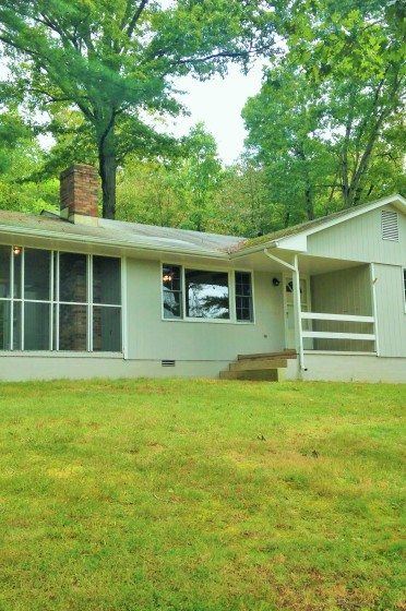 40 acres for sale with Blue Ridge views, pond and cottage